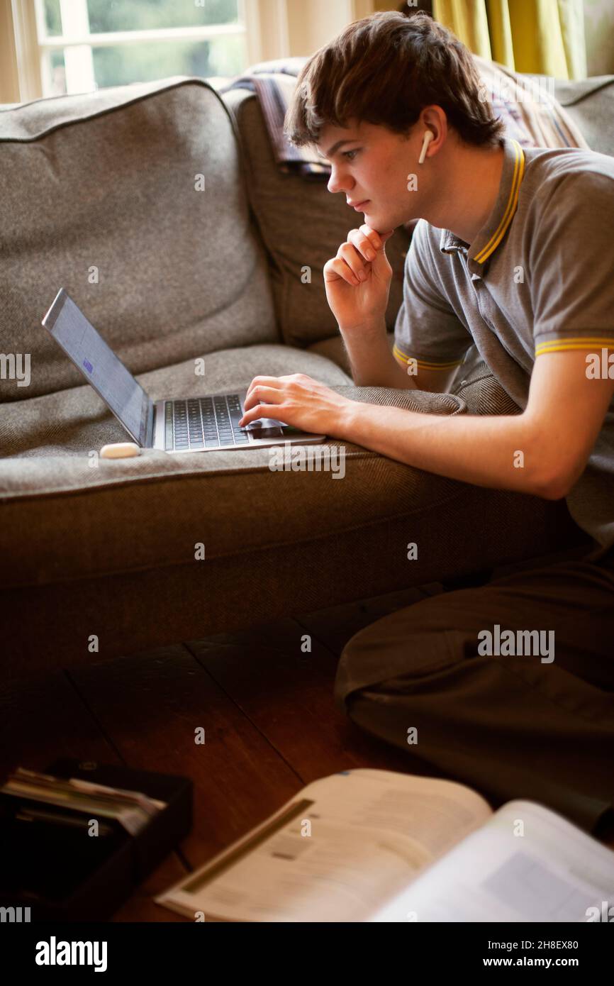 Boy in headphones sitting laptop hi-res stock photography and images ...