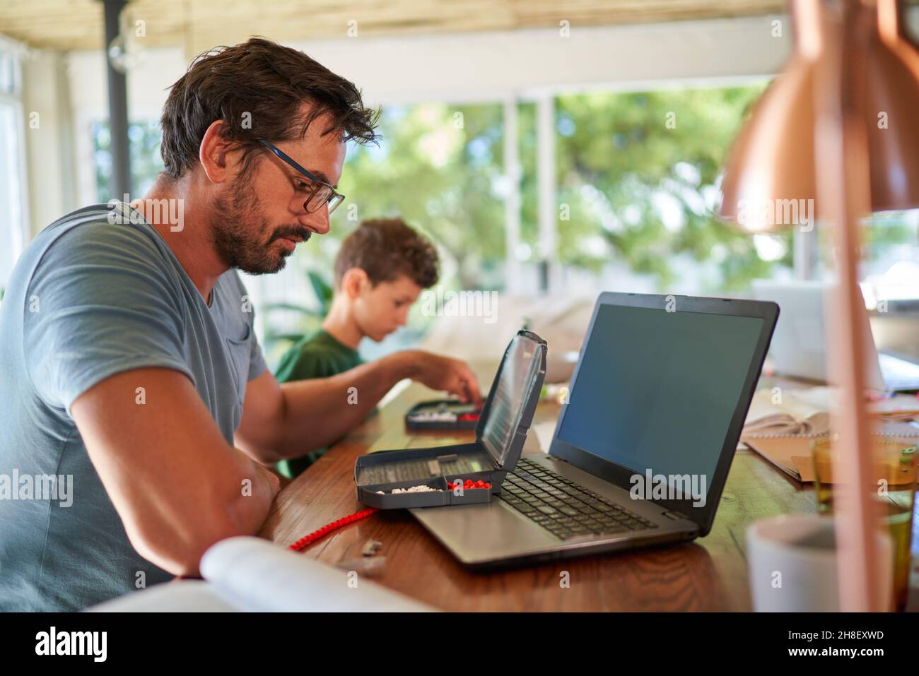 Working father multitasking from home hi-res stock photography and ...