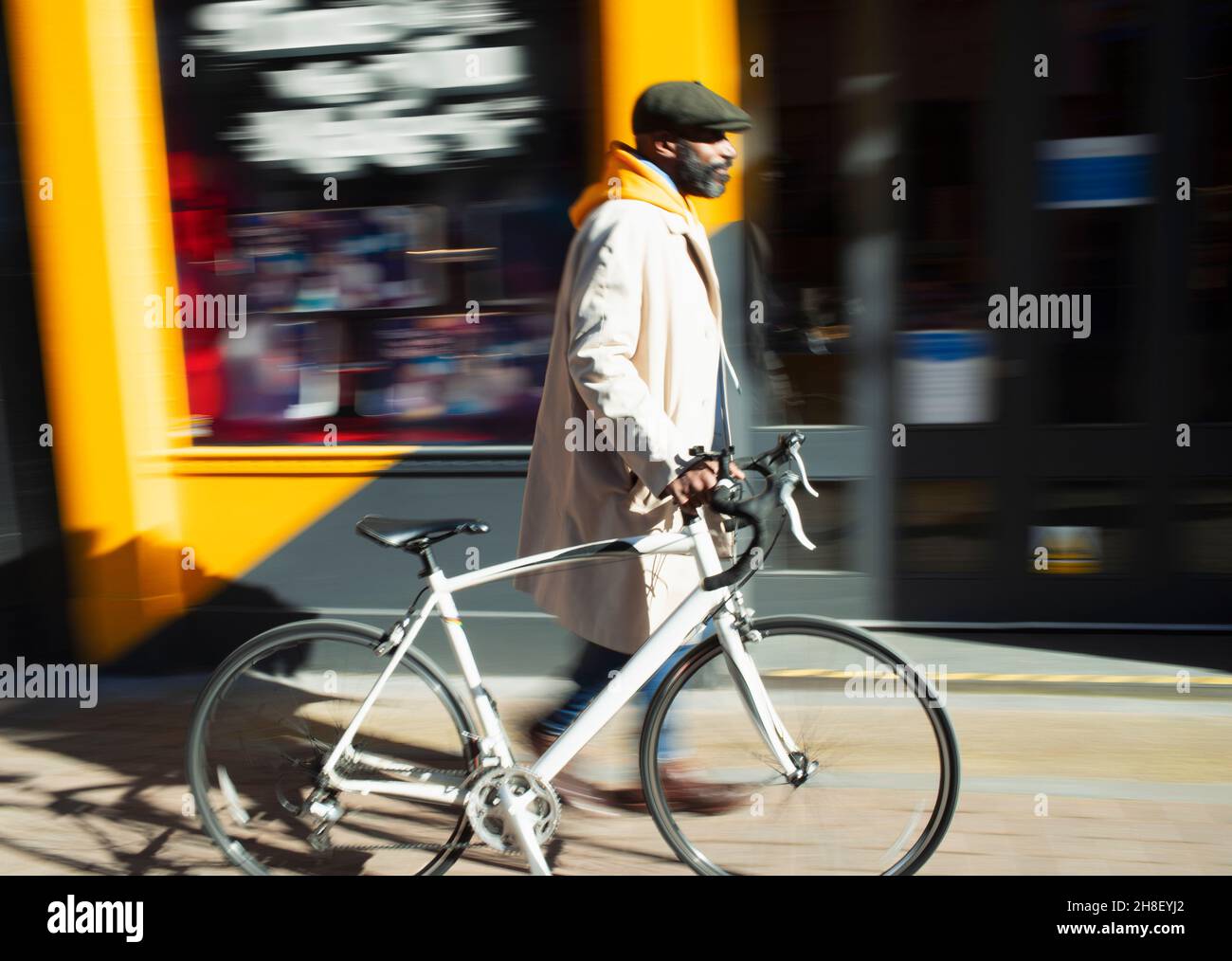Man walking bicycle hi-res stock photography and images - Alamy
