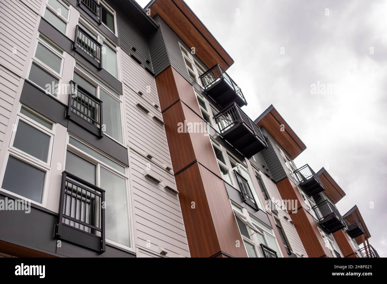 Low angle view of a Seattle apartment building, with wood paneling ...