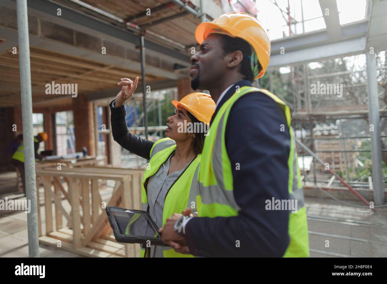 Engineers talking at construction site Stock Photo - Alamy