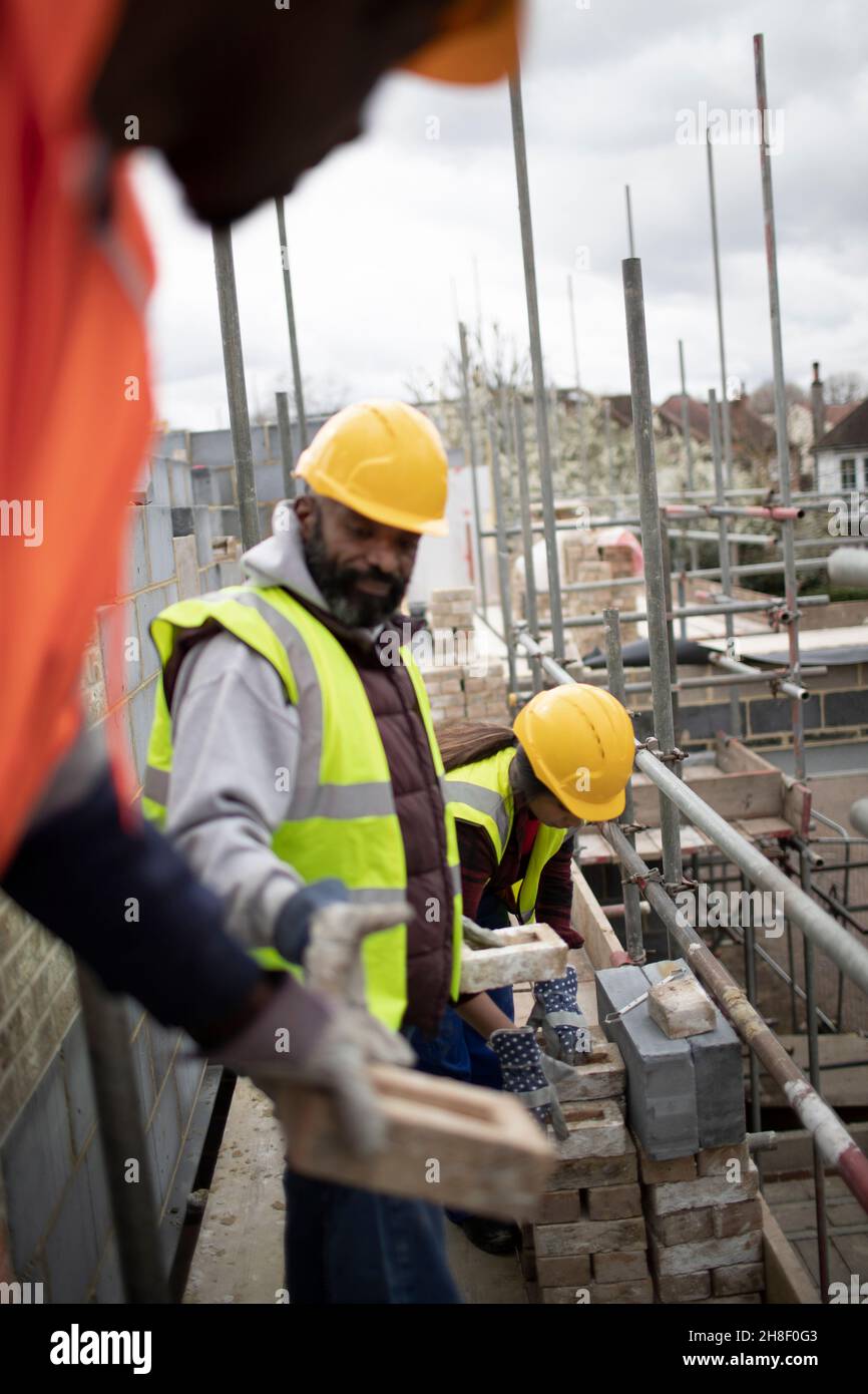 Construction workers bricklaying site hi-res stock photography and ...