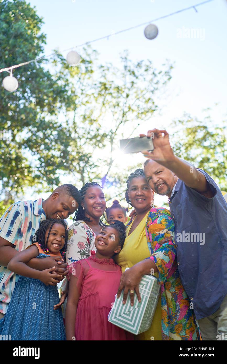 Happy multigenerational family taking selfie in summer backyard Stock ...