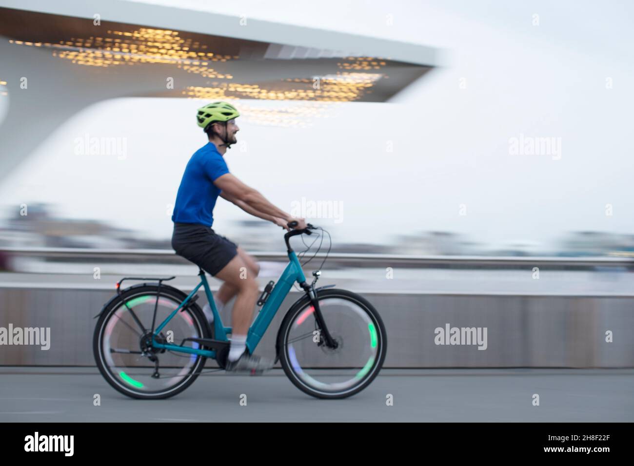 Side view man riding bicycle hi-res stock photography and images - Alamy