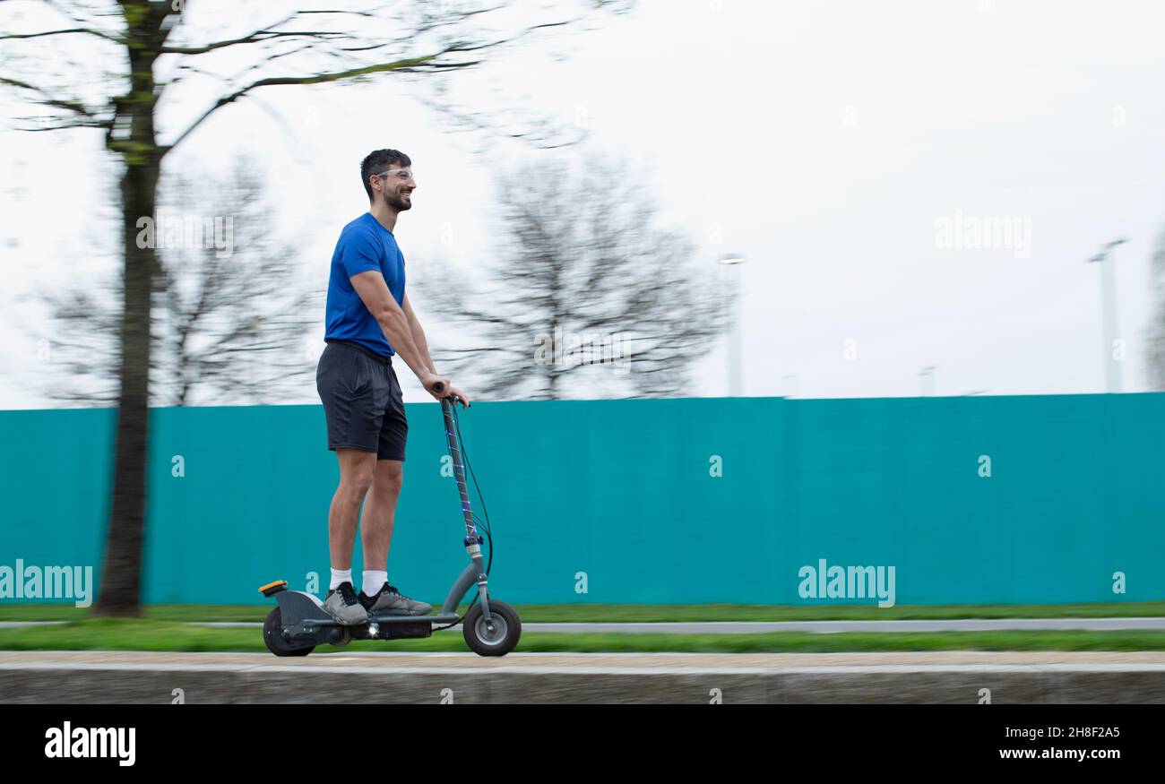 Adult man on scooter hi-res stock photography and images - Alamy