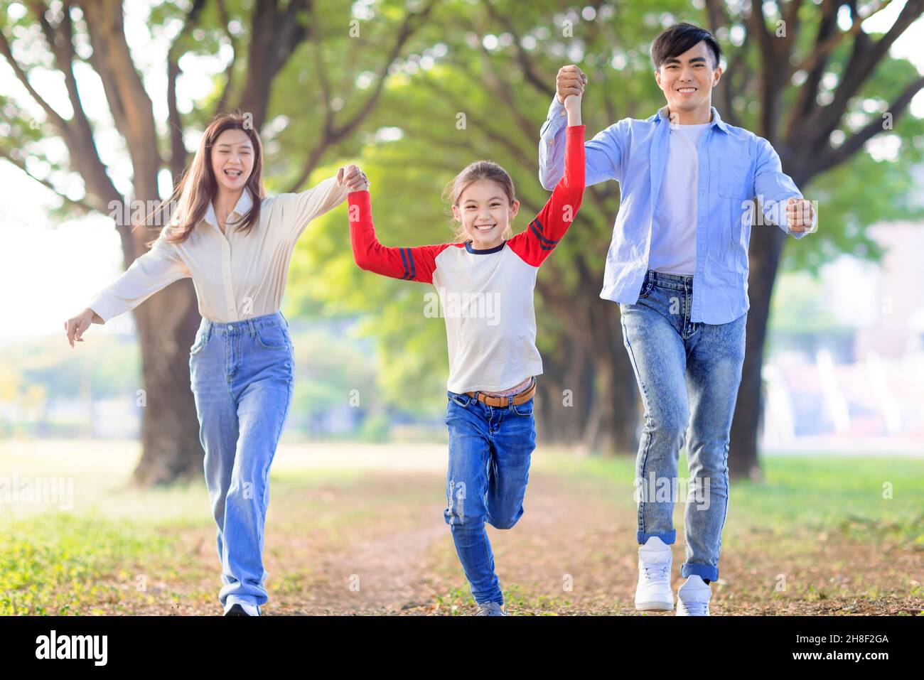Happy family run hi-res stock photography and images - Alamy