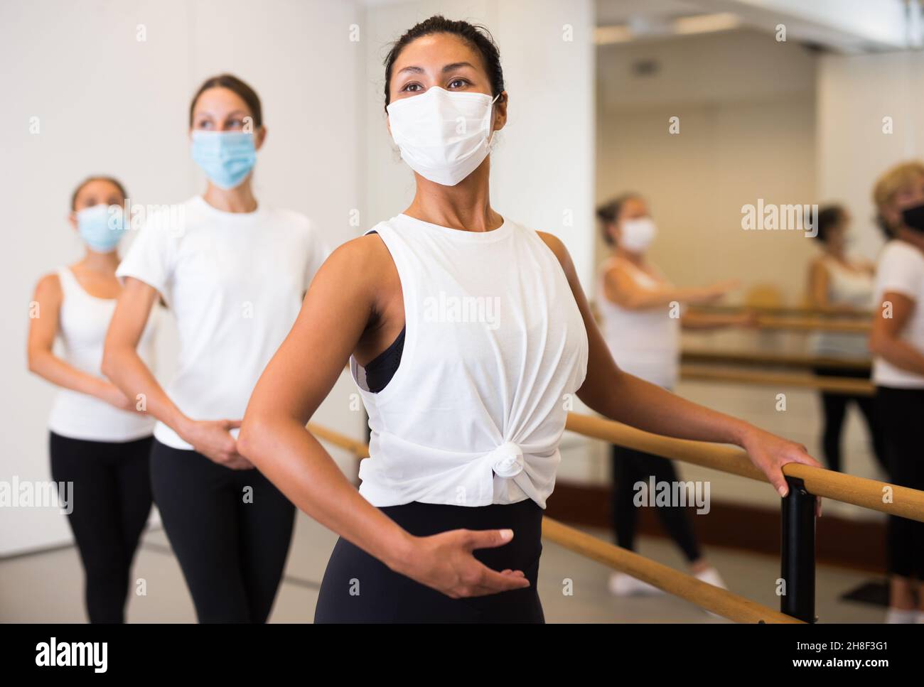 Group of women in masks doing ballet dance moves Stock Photo - Alamy