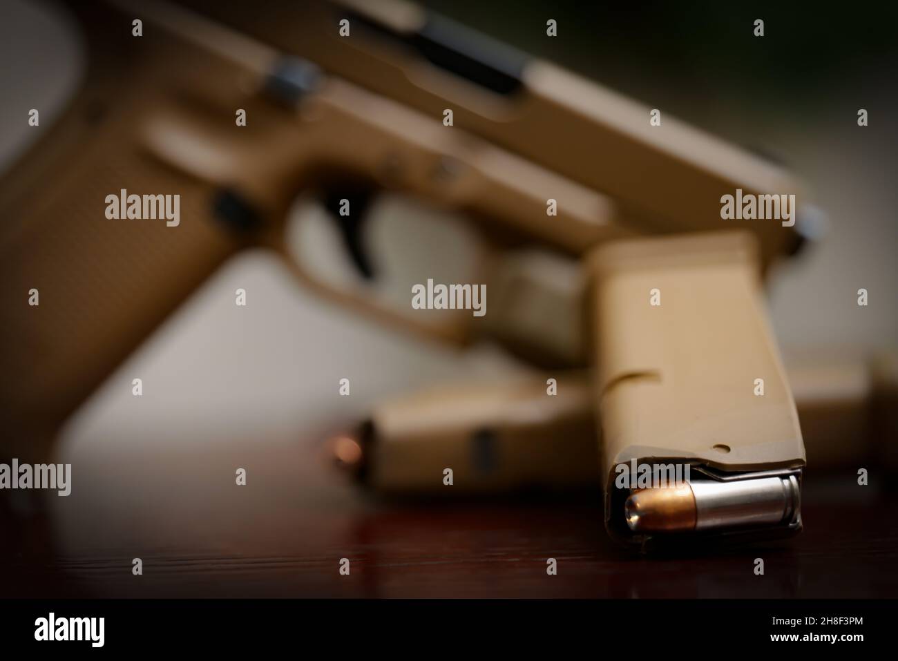 Handgun with magazine and bullet Stock Photo - Alamy