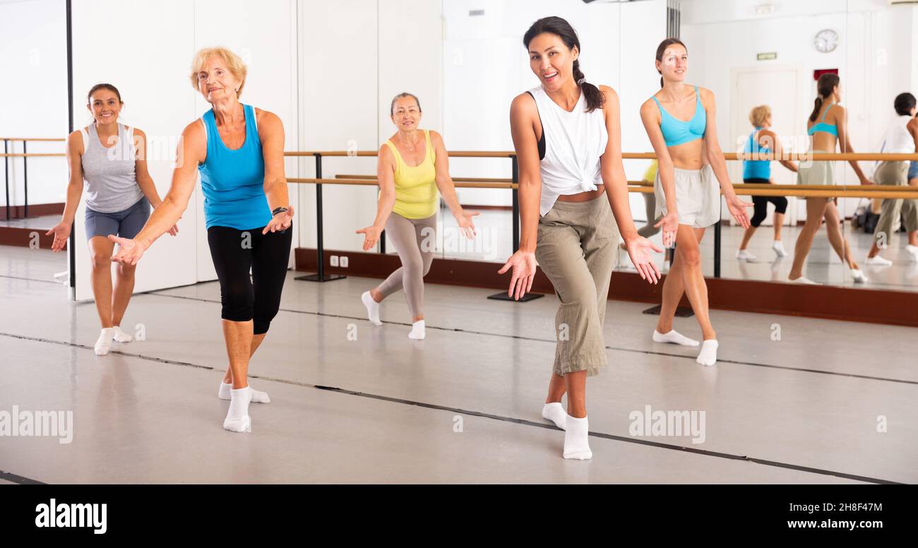 Modern active females dancing excited posing in studio Stock Photo - Alamy