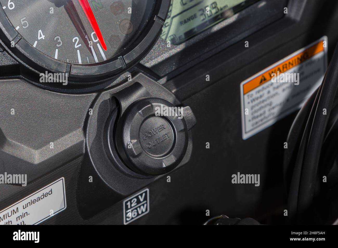Closeup of the speedometer of a modern motorcycle under the sunlight ...