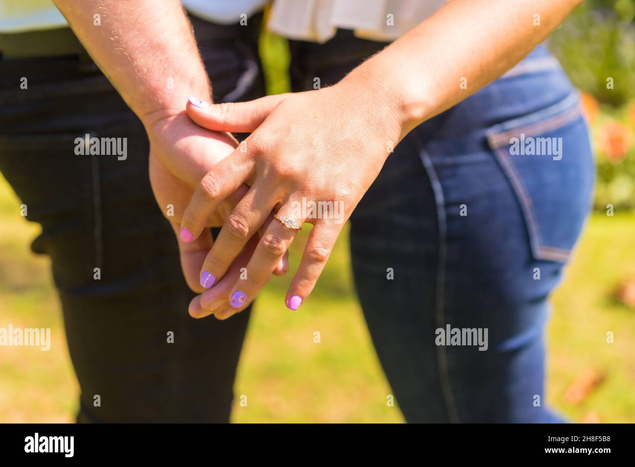 Closeup of hands of two unknown people in a marriage proposal with a ...
