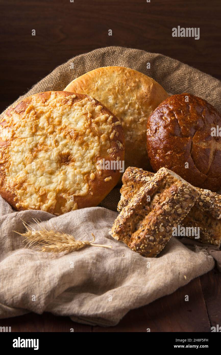A close up still life photo of various loafs of natural whole bread ...