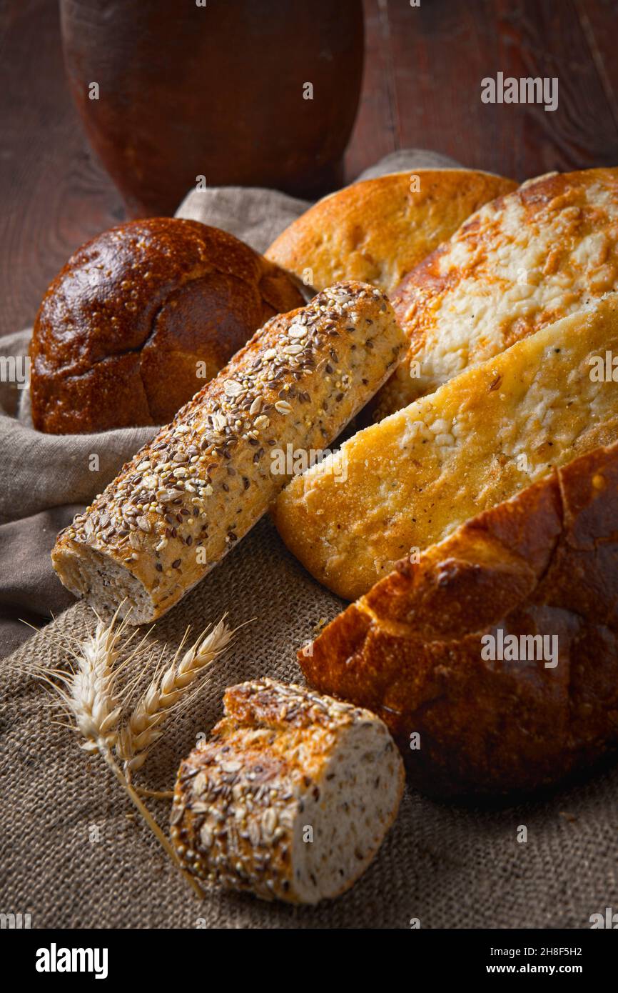 A close up still life photo of various loafs of natural whole bread ...
