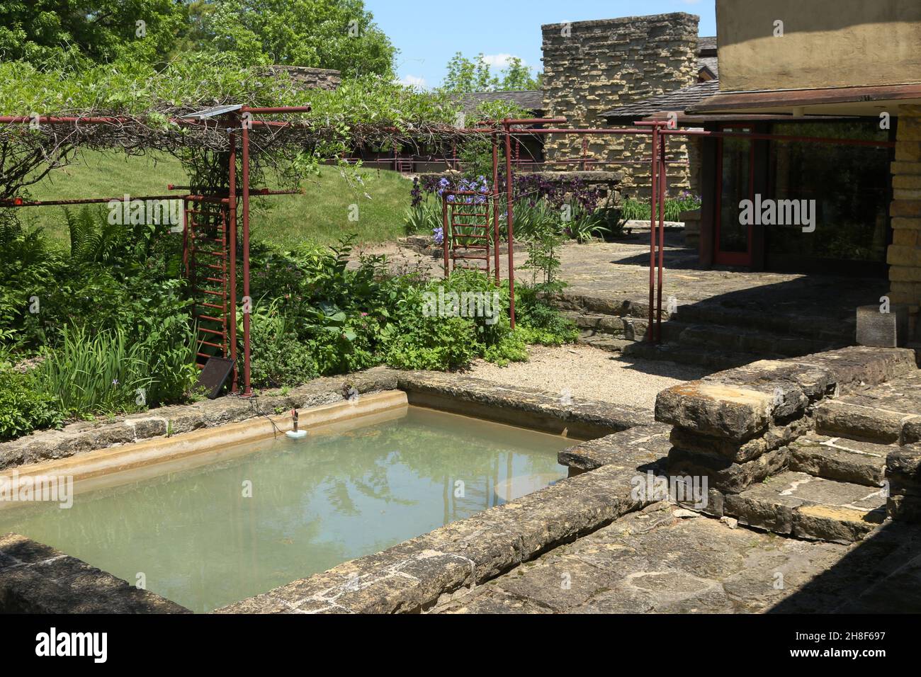 Taliesin house exterior. Garden pool. Architecture and decor design by ...
