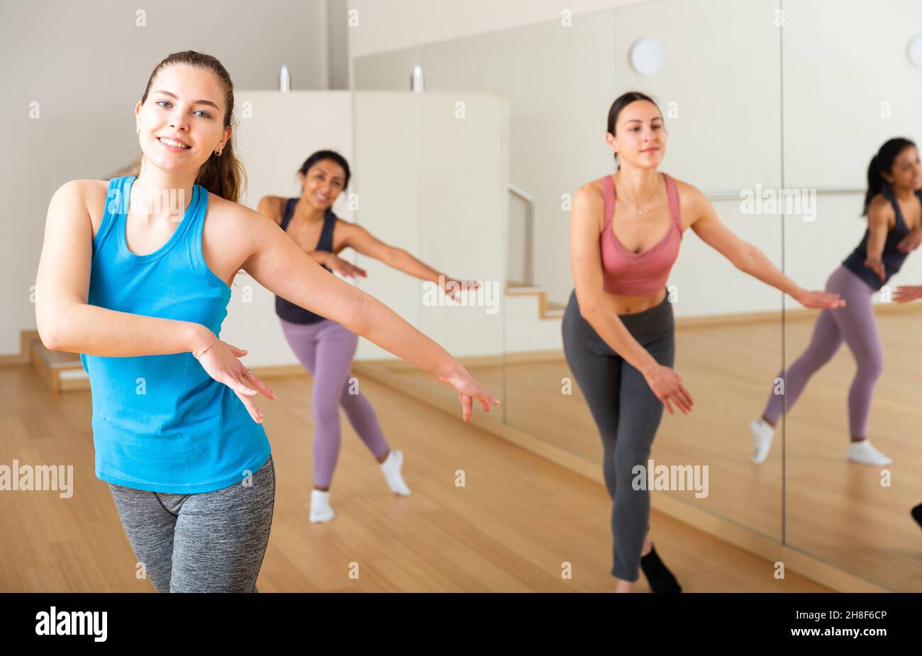 Group of smiling women training sport dance Stock Photo - Alamy