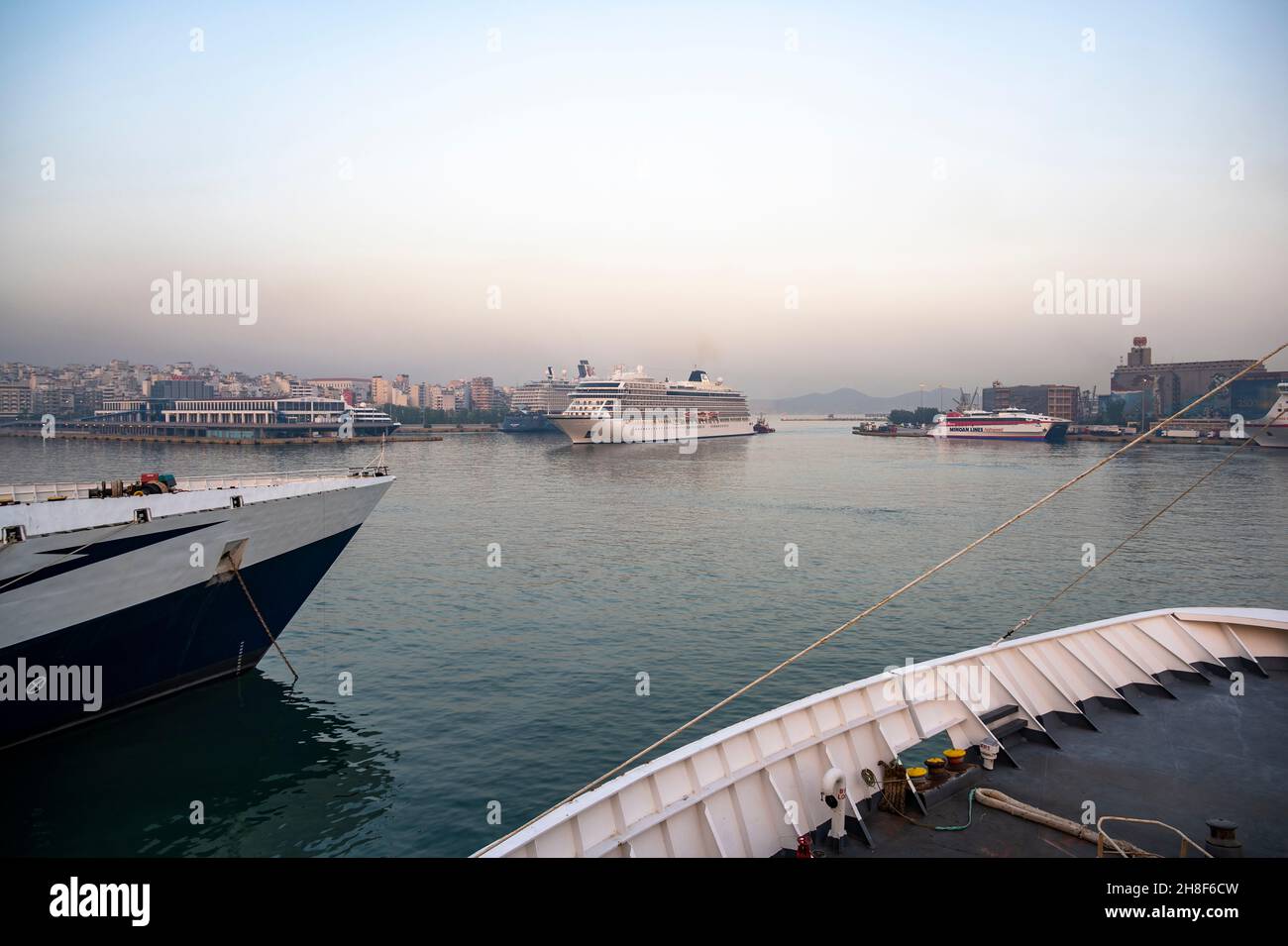 the bow of a ferry boat ship looking out at the exit to the port of ...