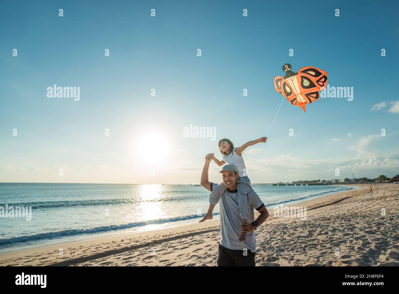 Little girl father flying kite hi-res stock photography and images - Alamy