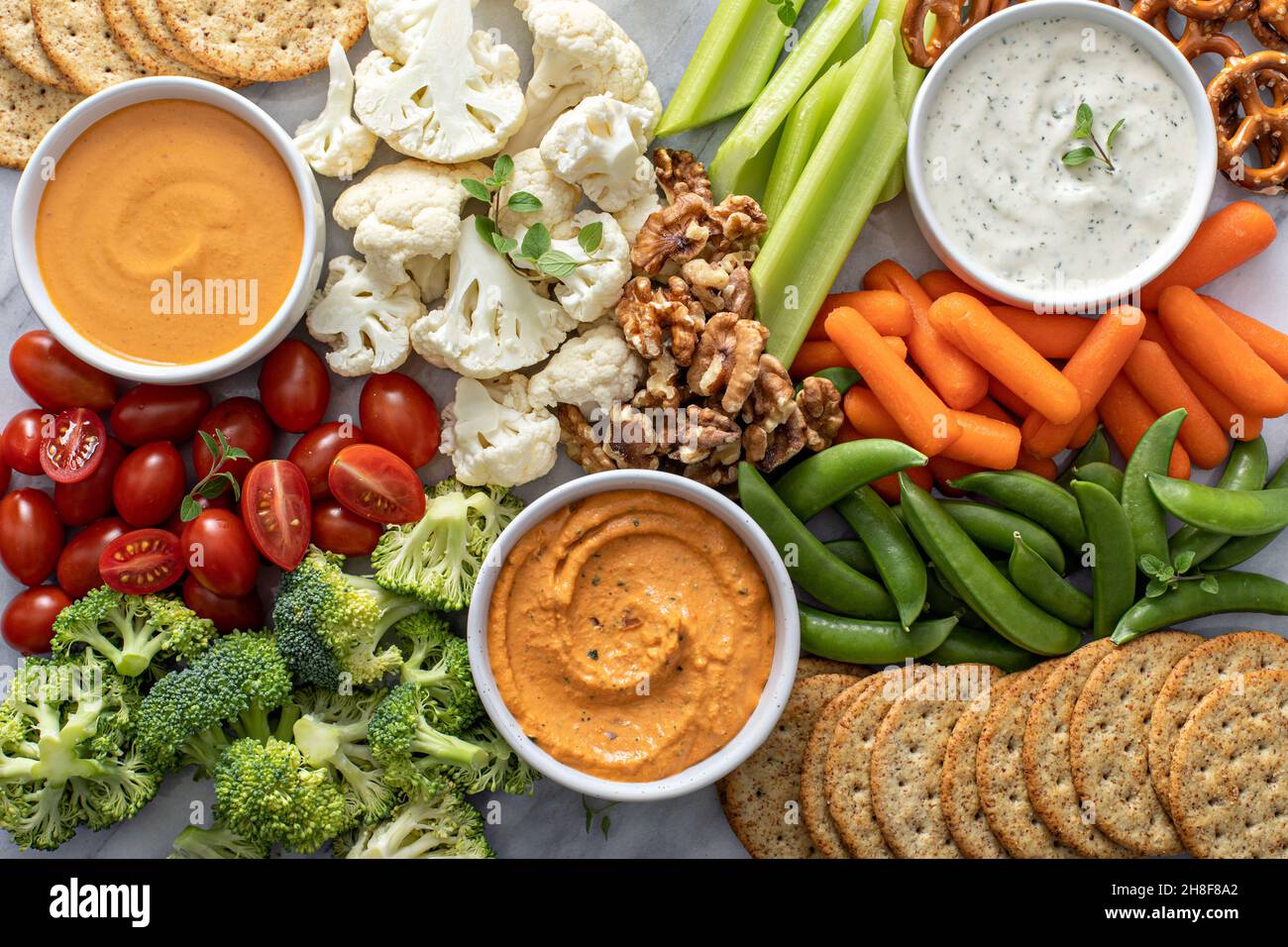 Plant based snack board with vegetables and crackers Stock Photo - Alamy