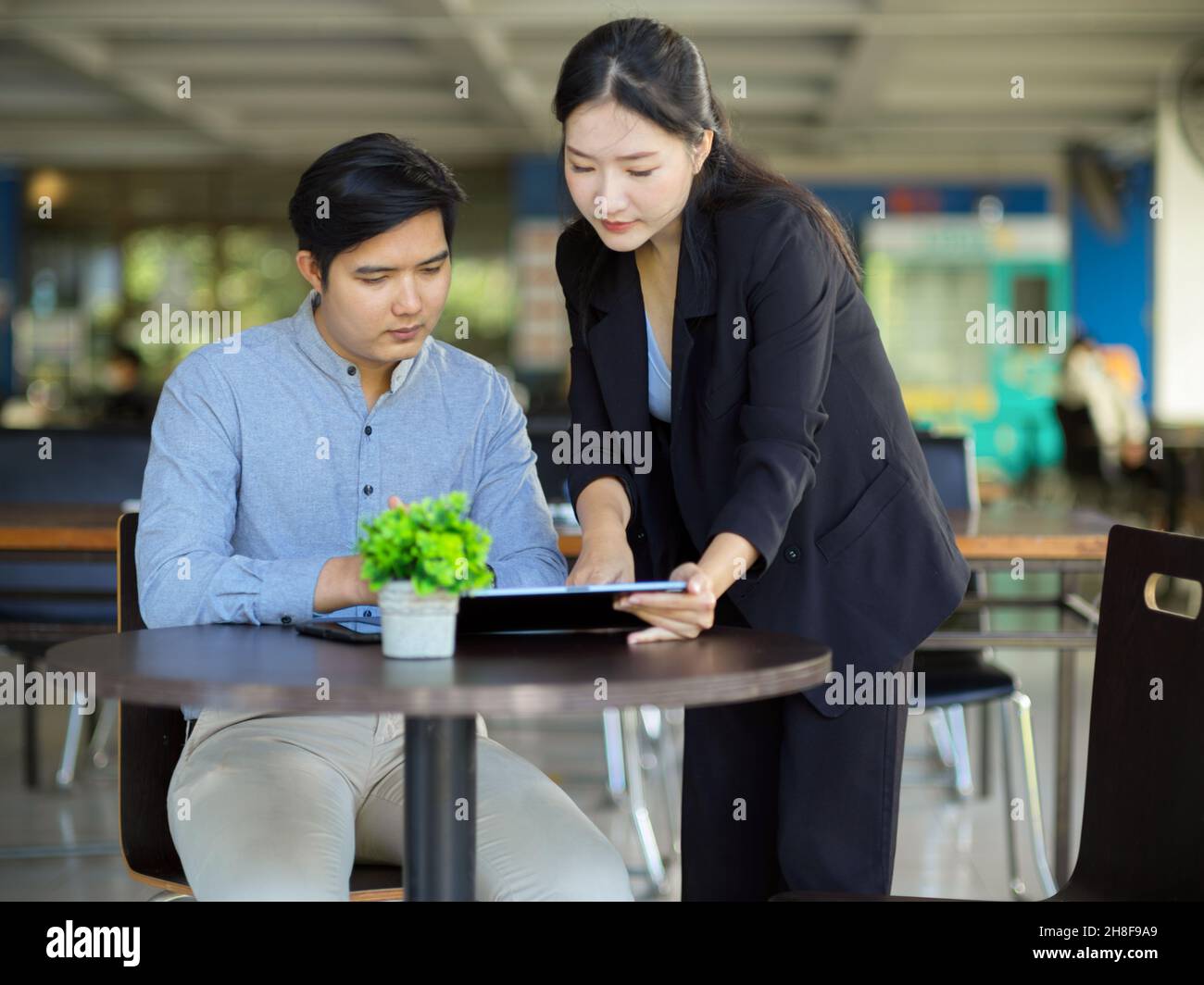 Executive female manager training her new staff, coaching a new ...