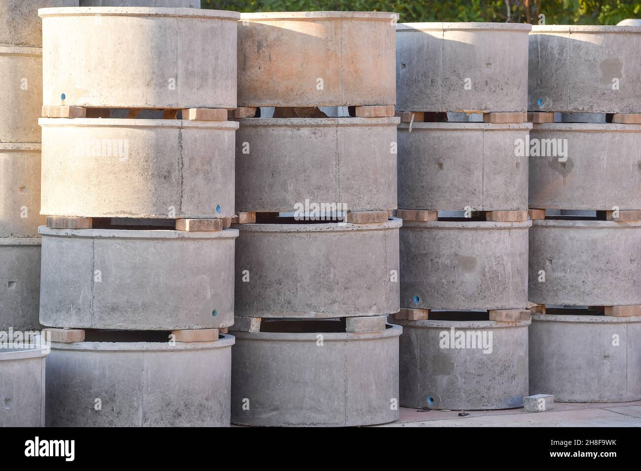 a pile of waste water drain concrete pipe or concrete tube stack on ...