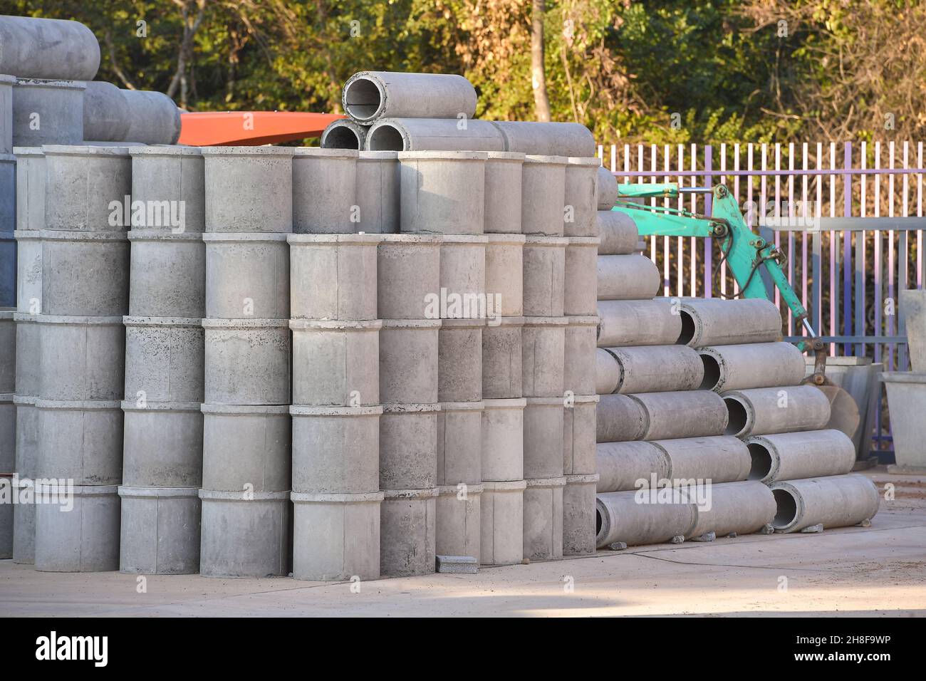 a pile of waste water drain concrete pipe or concrete tube stack on ...