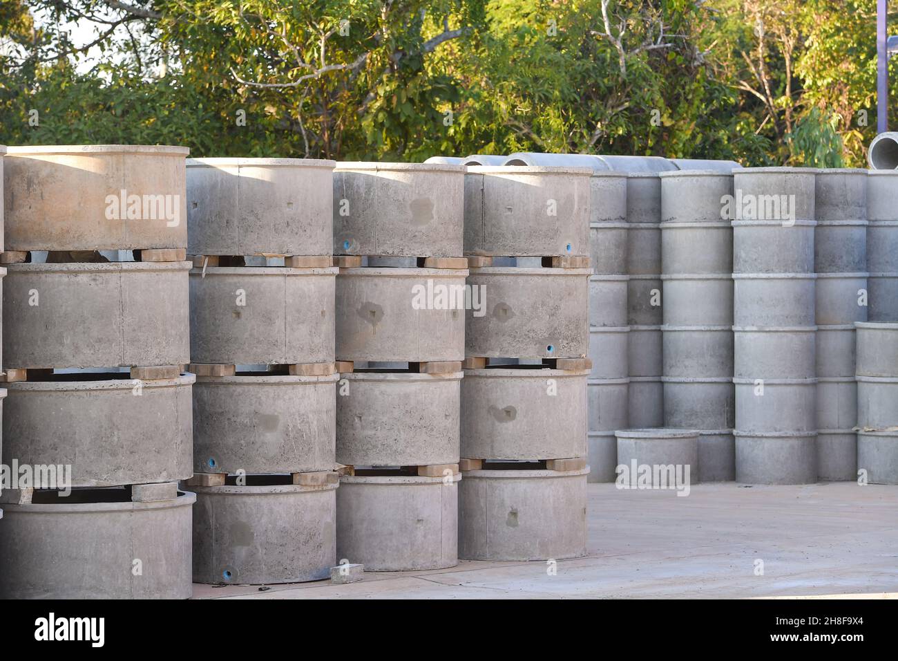 a pile of waste water drain concrete pipe or concrete tube stack on ...