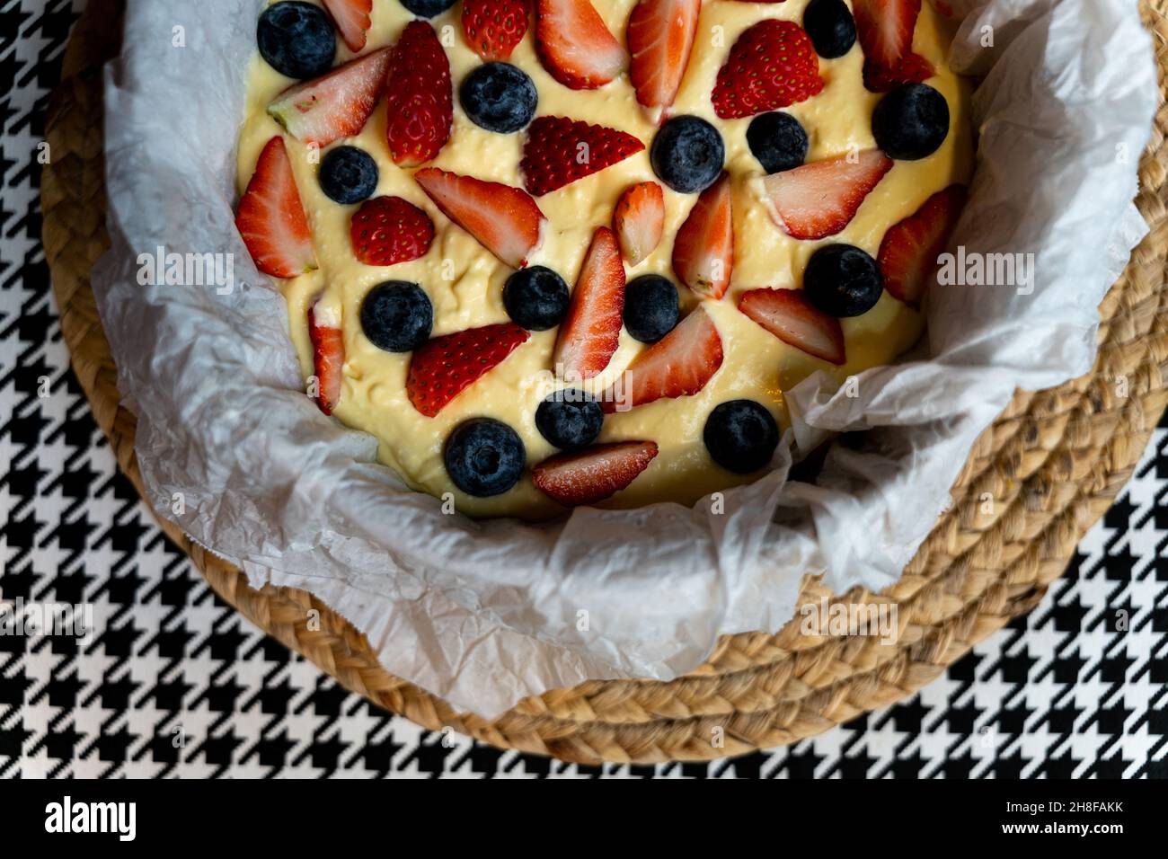 Strawberry and blueberry yellow cake in round baking tray Stock Photo ...