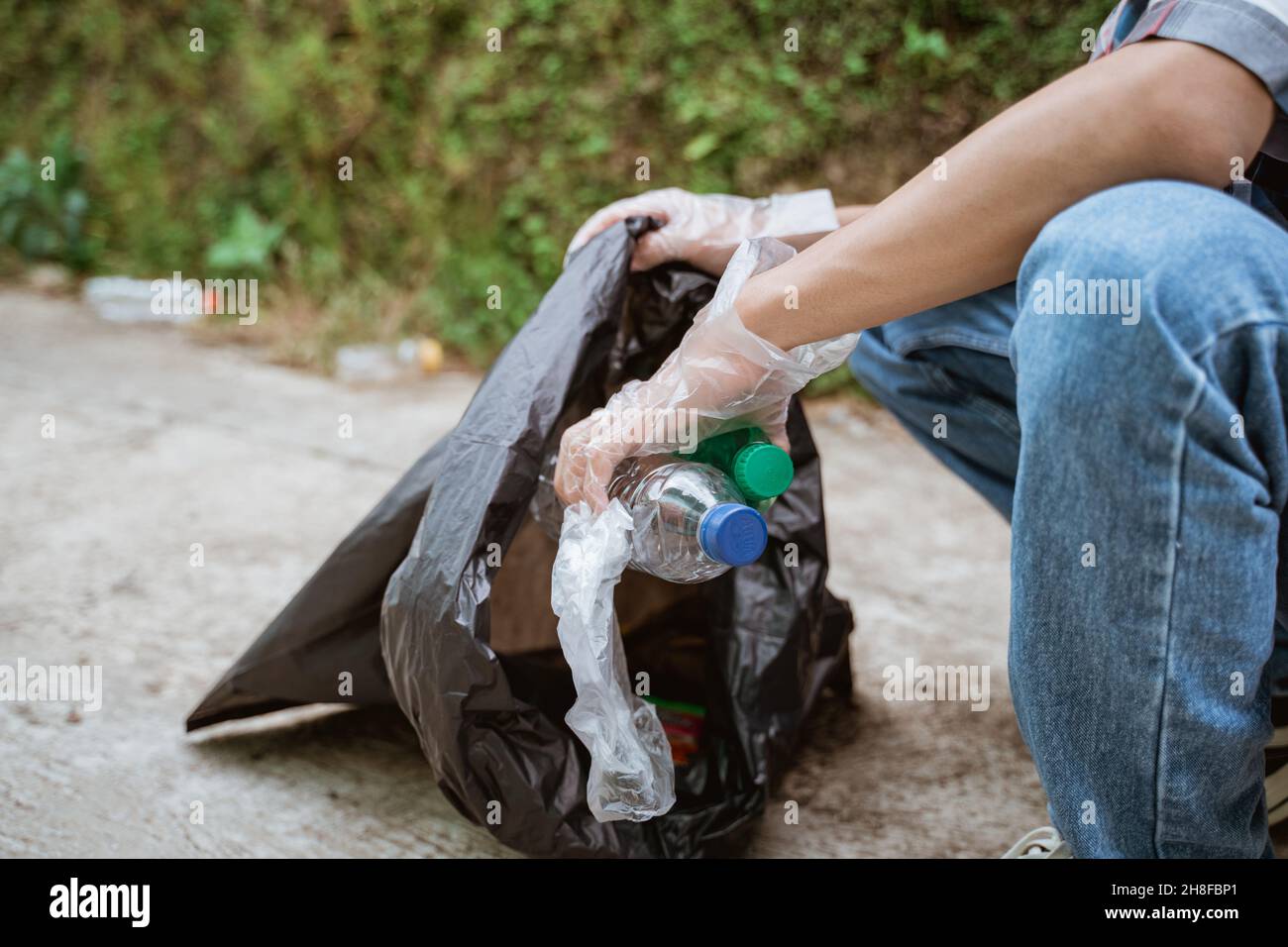 Hand Picking Up Trash