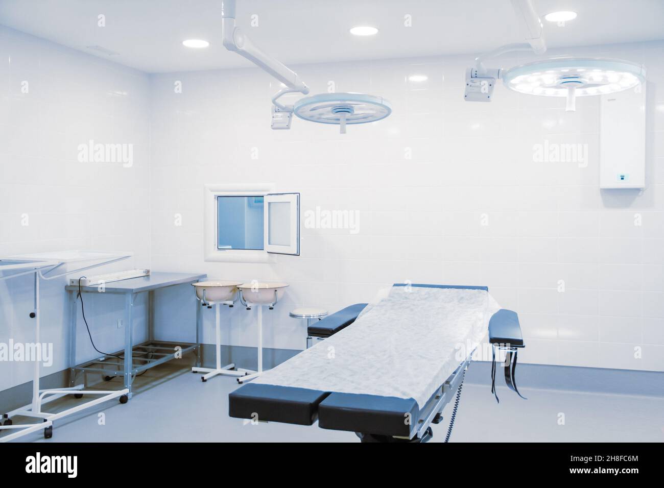 Empty interior operating room and modern equipment in hospital. Medical ...