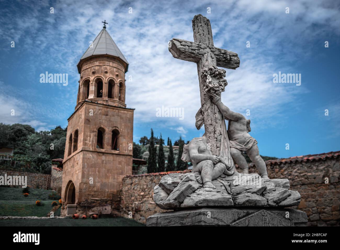 Scenic view of the sculpture depicting headless angels holding a cross ...