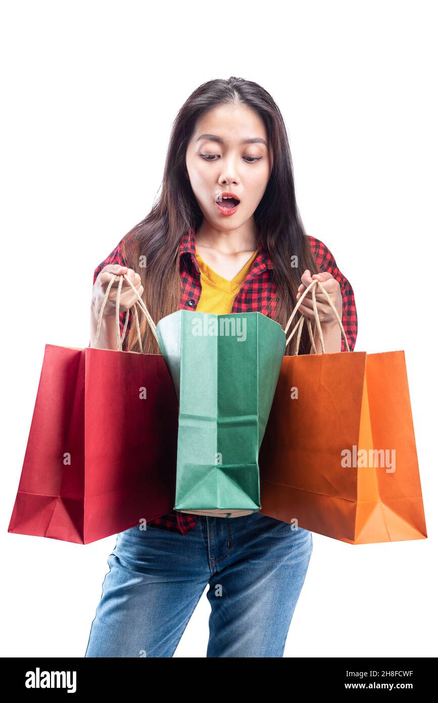 Woman opening shopping bags hi-res stock photography and images - Alamy