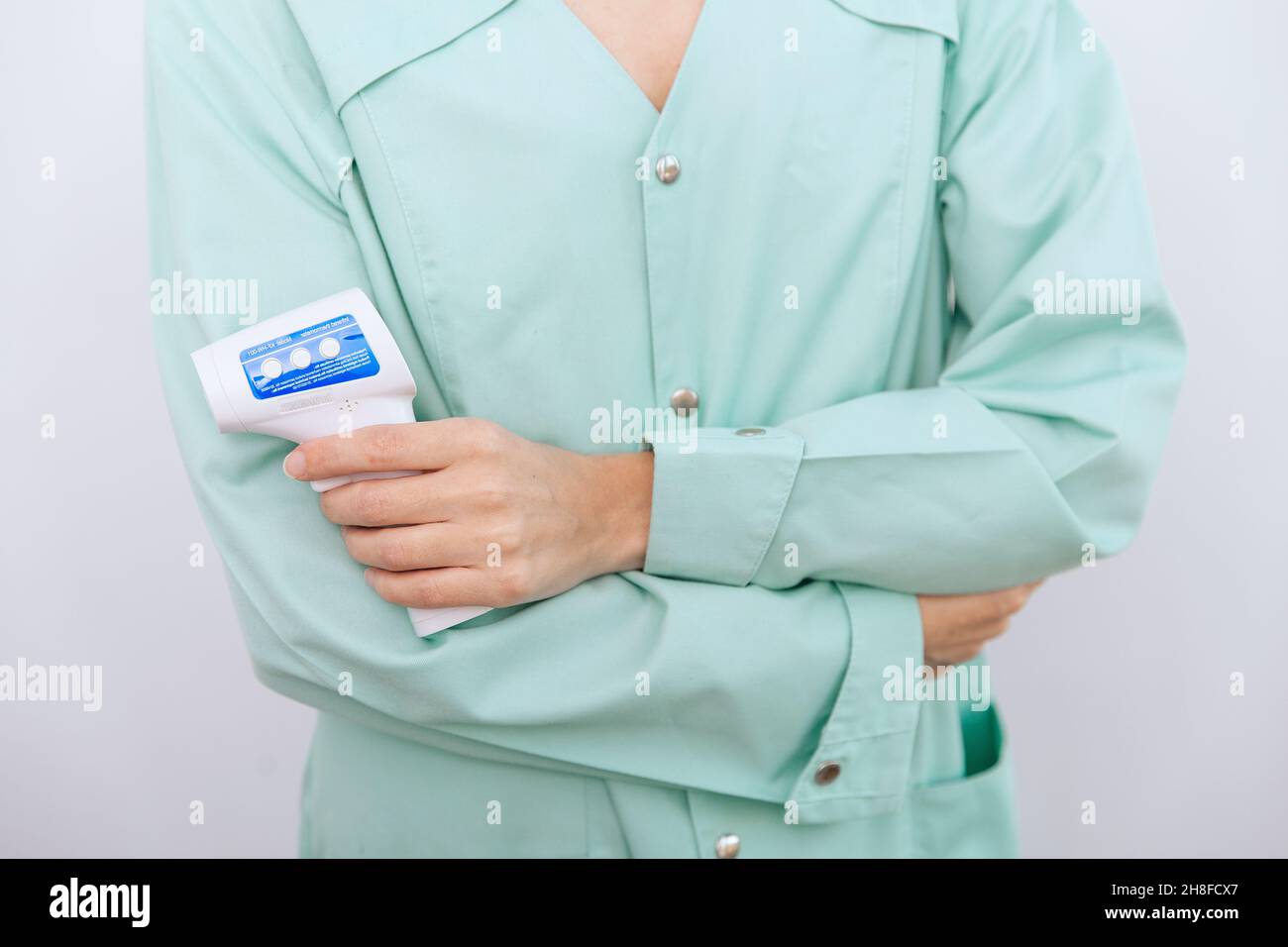 Temperature measurement gun in doctor hands. Close-up shot of doctor ...