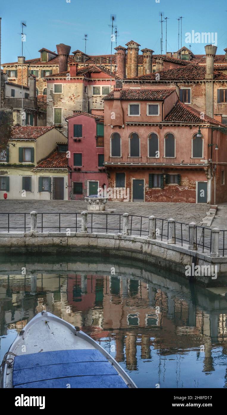 nice view of a canal surrounded by buildings with typical Venetian ...