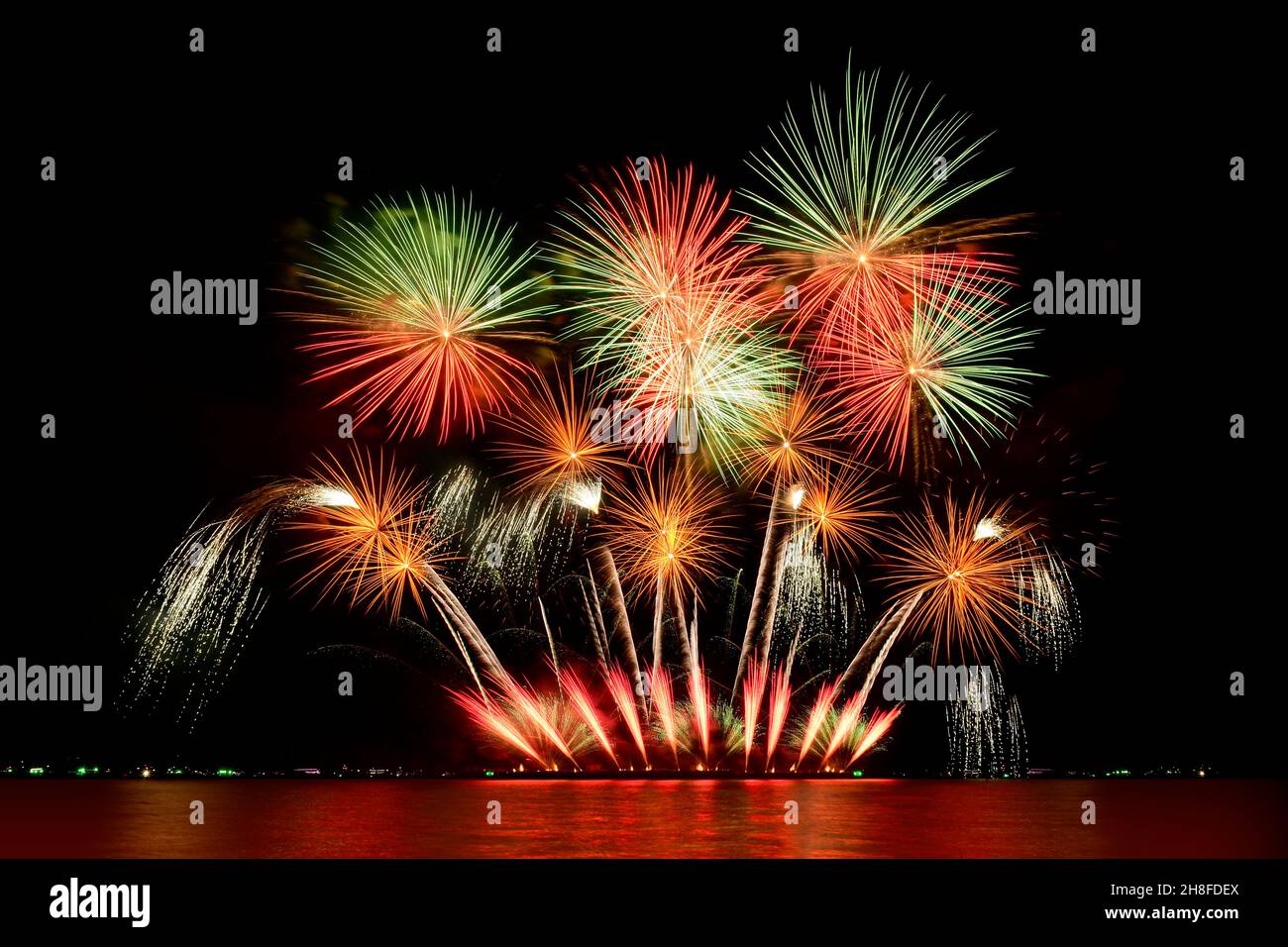 Firework celebration from the sea shore. Colorful fireworks celebration ...