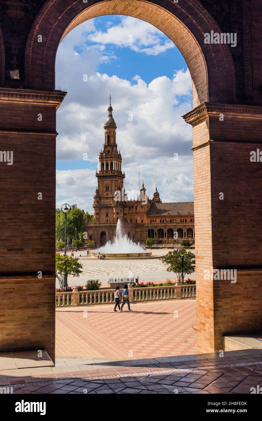 One of the towers of the Plaza de España in Seville framed in one of ...