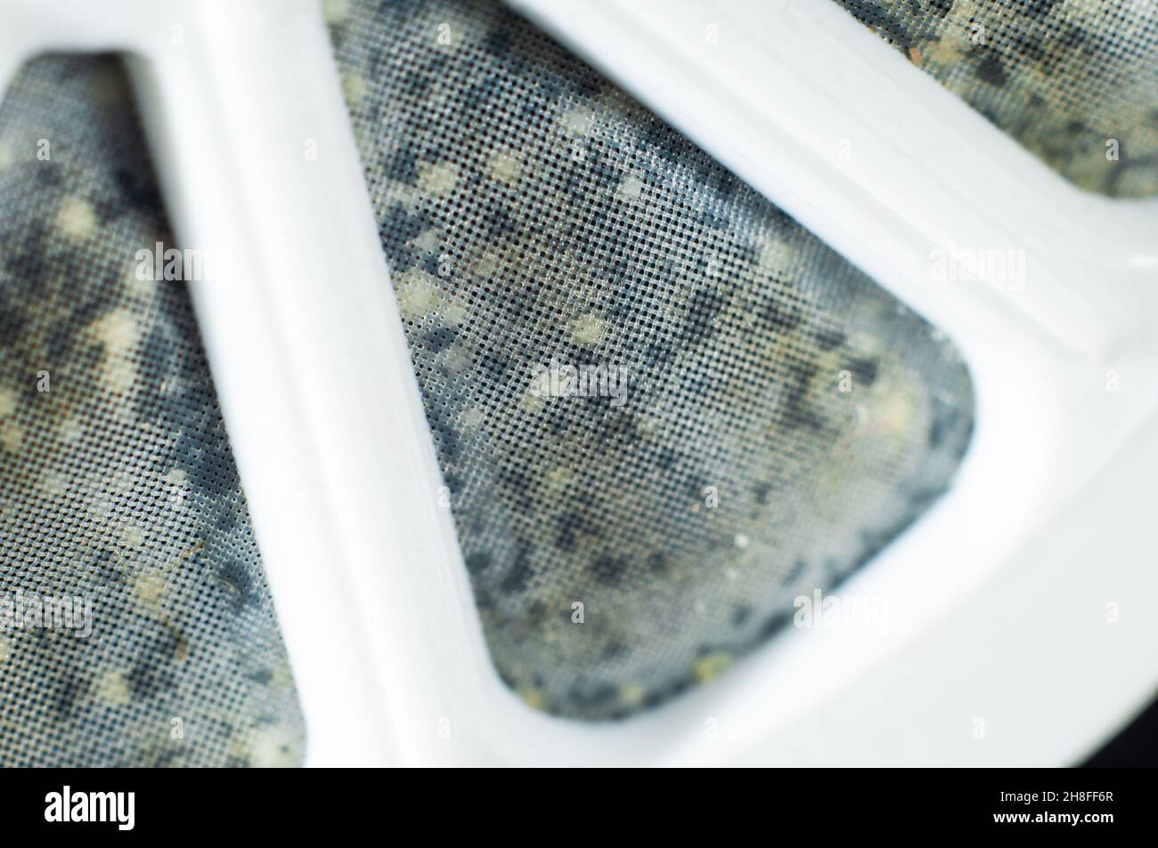 The bottom of the replaceable water filter. Hole from which water flows ...