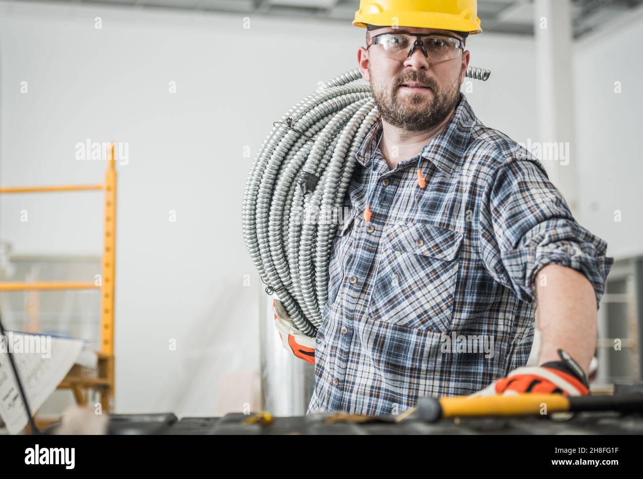 Caucasian Electrician Contractor Worker in His 30s with Metal Electric ...