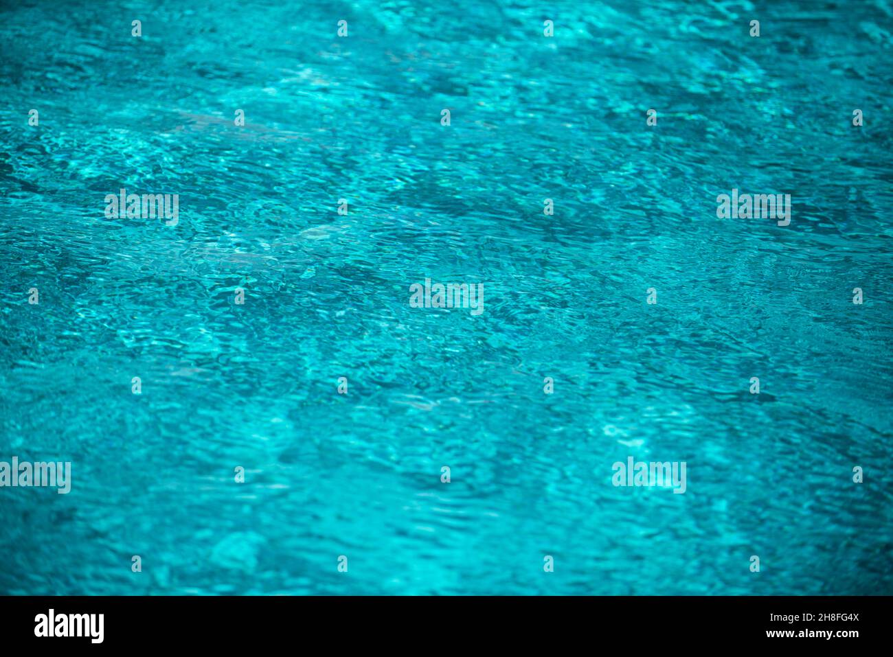 Abstract ripple wave and clear turquoise water surface in swimming pool ...