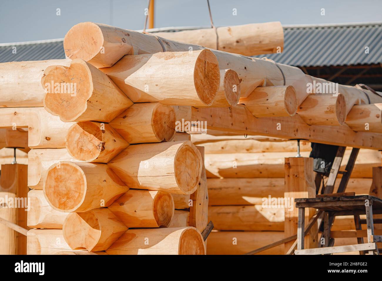 New house wooden log construction interior with exposed framing roof ...