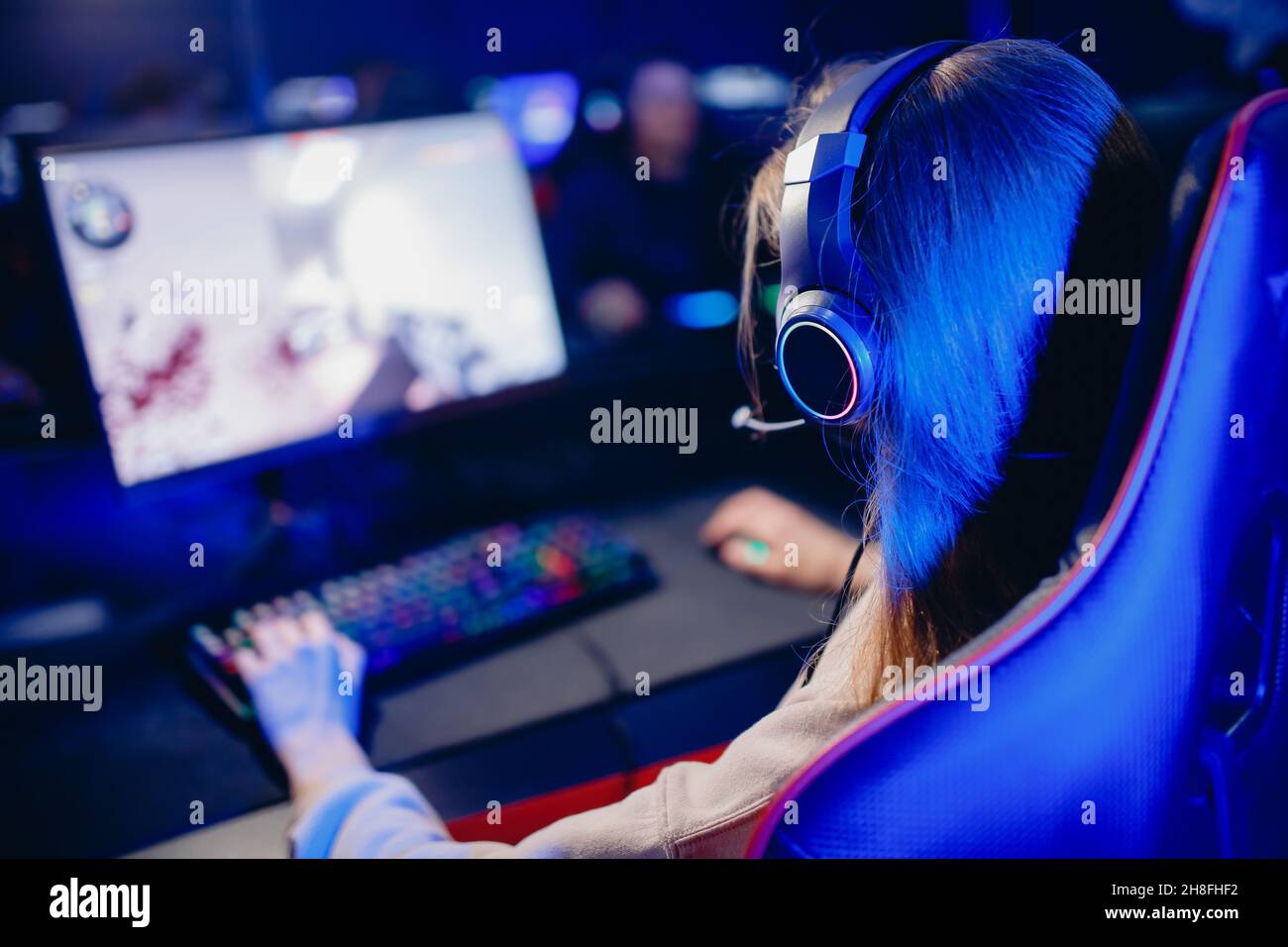 Professional cyber video gamer woman in studio room with personal ...