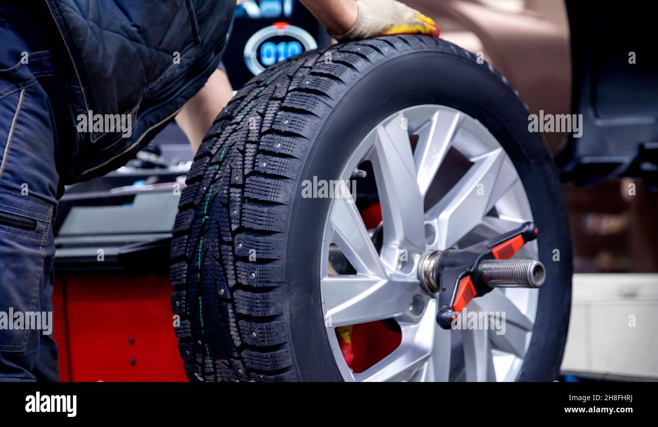 Spare tire installation hi-res stock photography and images - Alamy