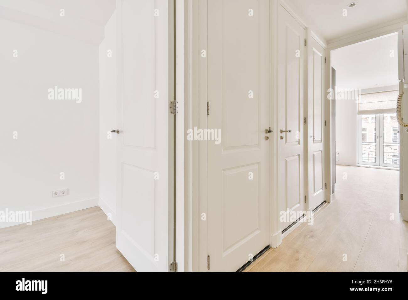 A long empty corridor designed in minimalistic style Stock Photo - Alamy