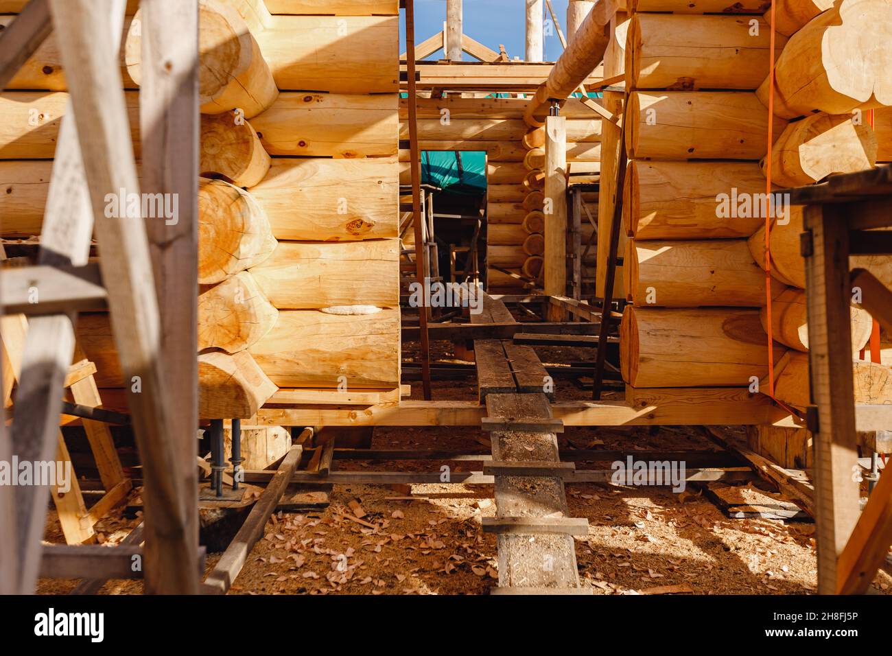 New house wooden log construction interior with exposed framing with ...