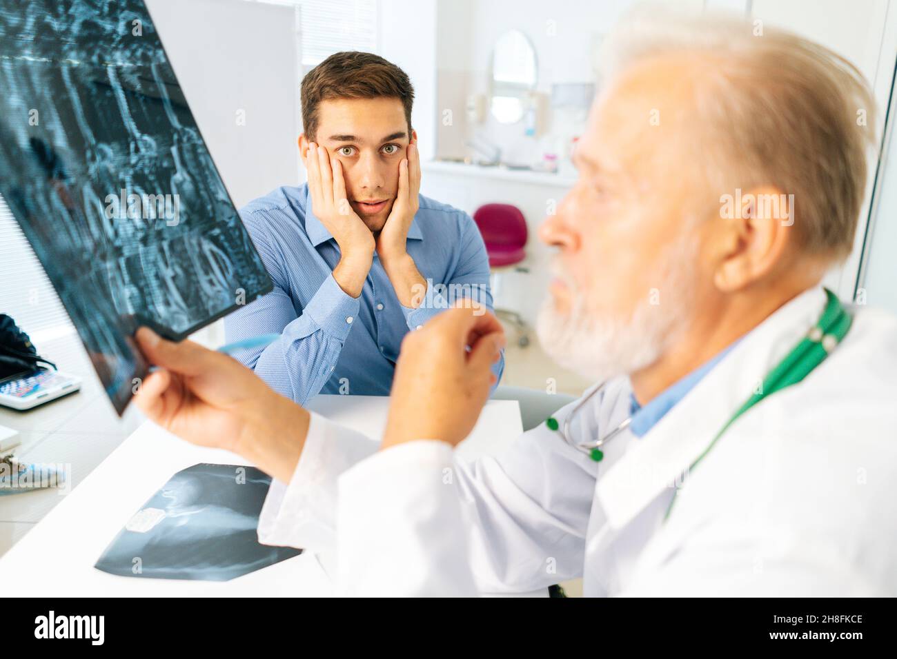 Doctor looking xray result hi-res stock photography and images - Alamy