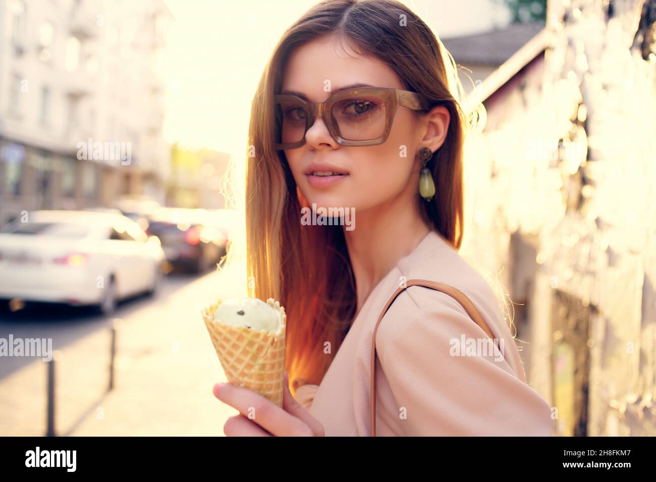 Girl walking eating ice cream on hi-res stock photography and images ...