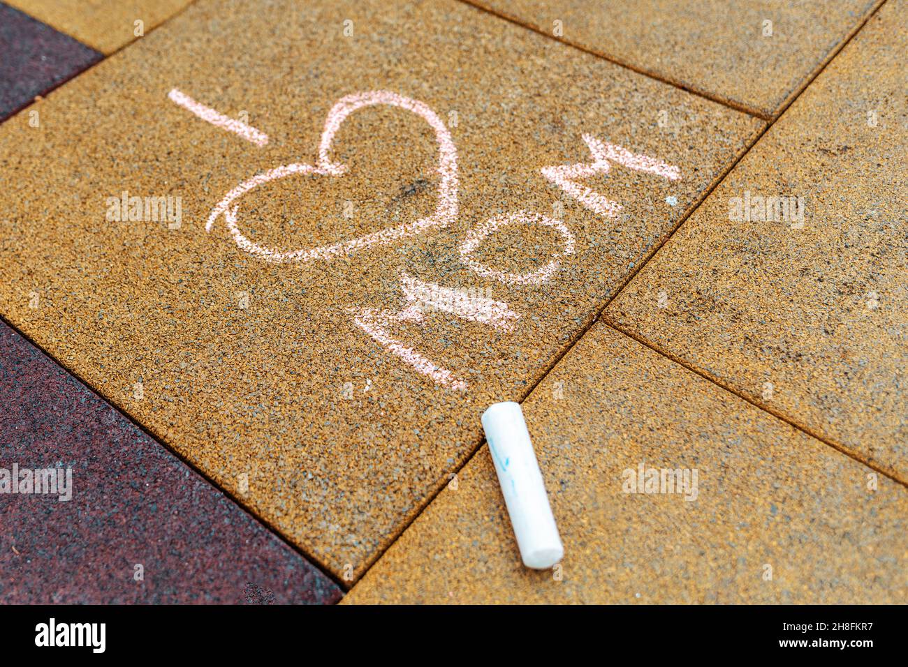 Children's chalk drawing on the ground. I love Mom. Mother's Day ...