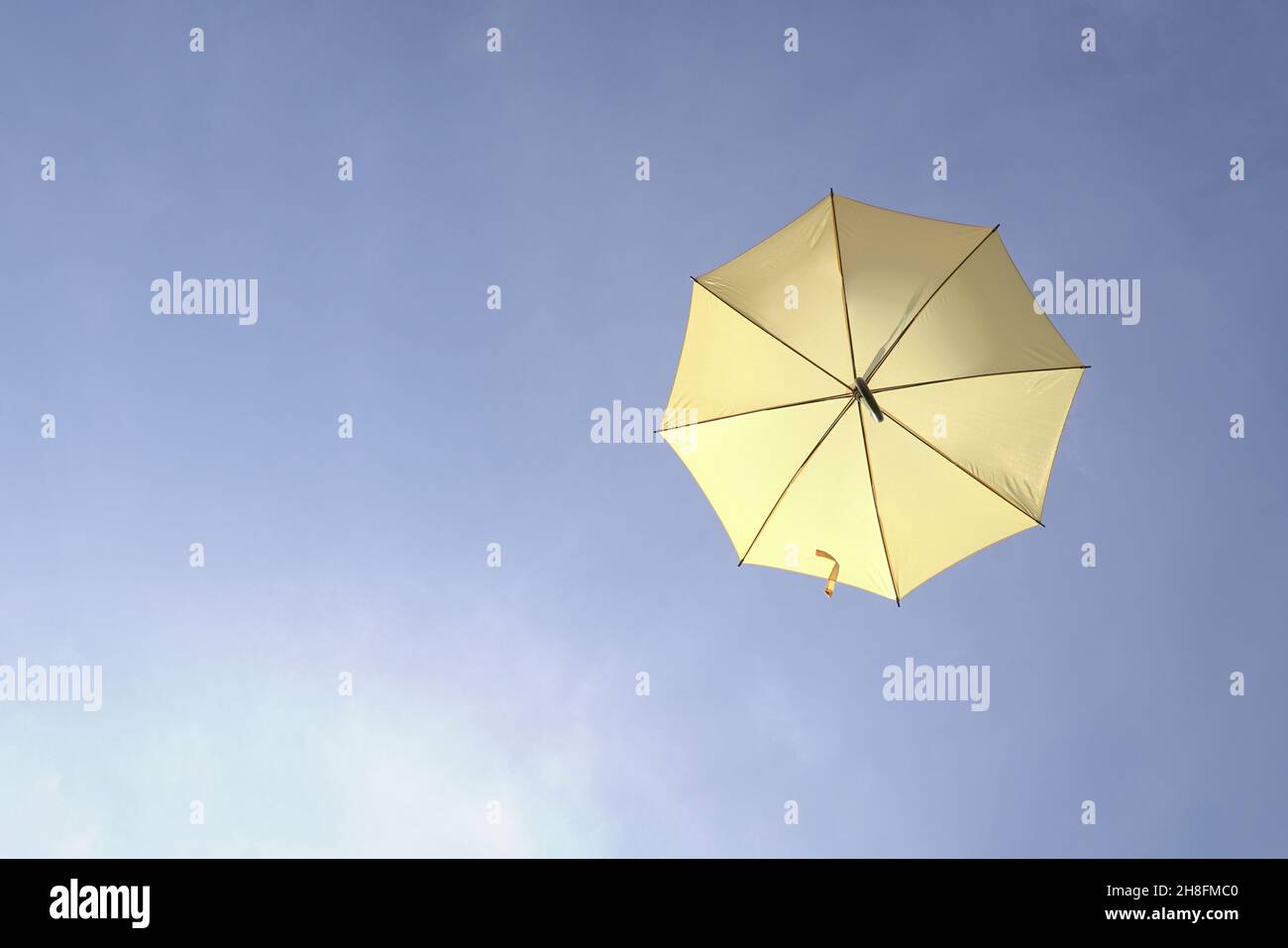 Blue and yellow umbrella hi-res stock photography and images - Alamy