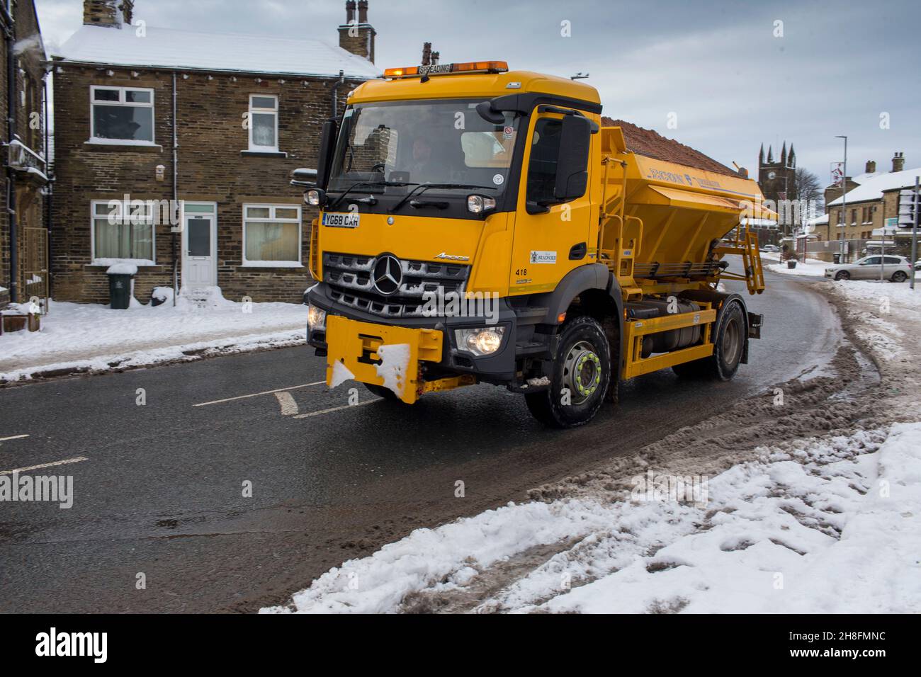 A Mercedes Arocs gritter lorry on the main street in Queensbury , West ...