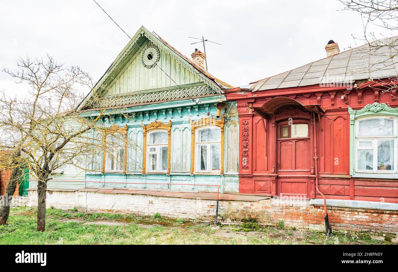 Wooden house in the traditional Russian style with carved platbands ...
