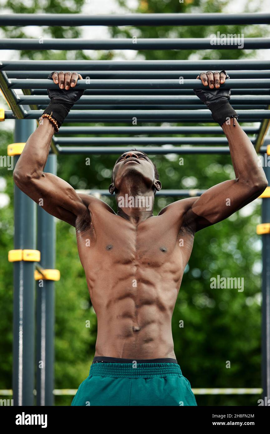 Working out in the morning. Young strong african man in sportswear ...